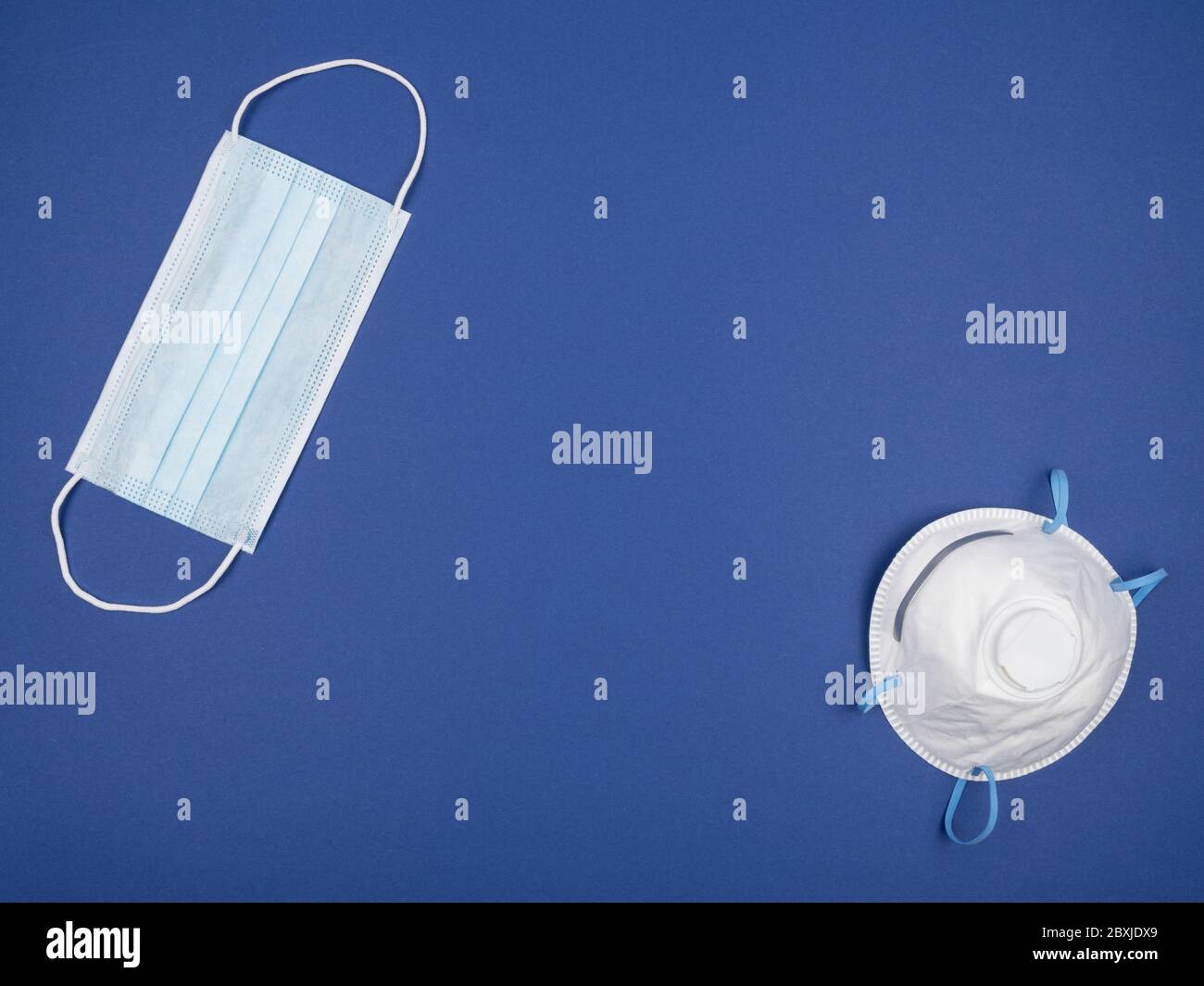 Medical personal protective equipment on a blue background Stock Photo ...