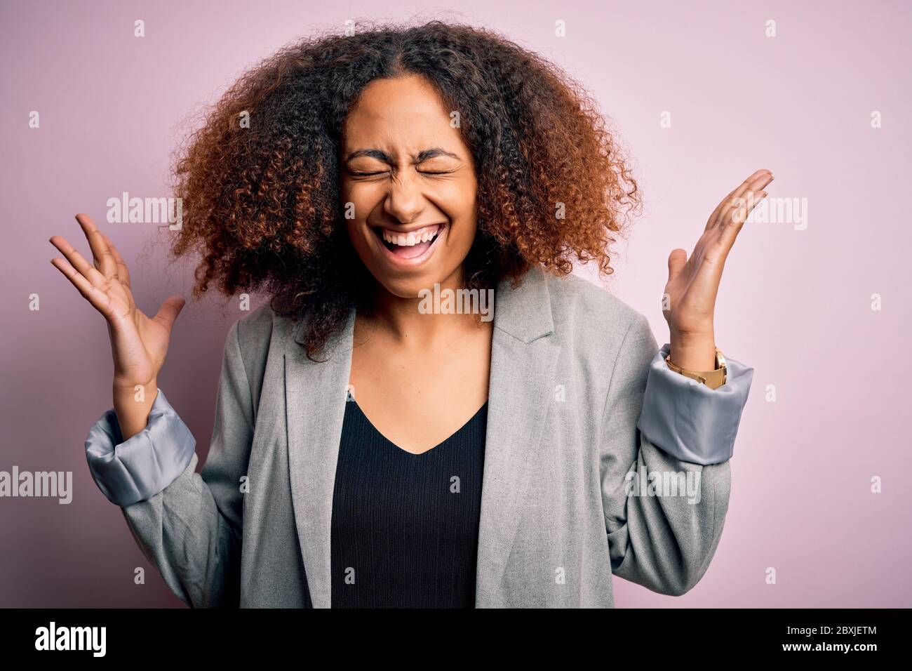 Young african american businesswoman with afro hair wearing elegant ...