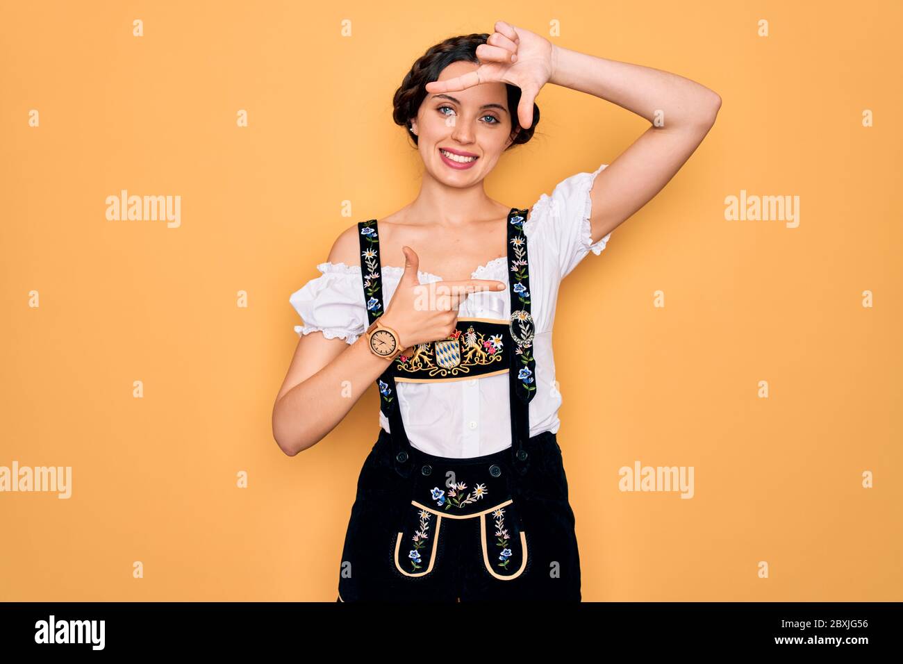 Young beautiful german woman with blue eyes wearing traditional ...