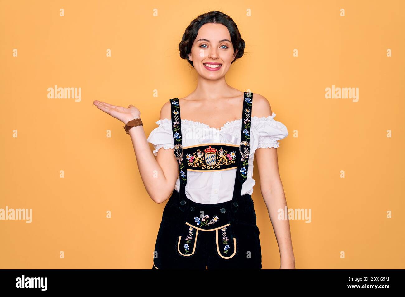 Young beautiful german woman with blue eyes wearing traditional ...