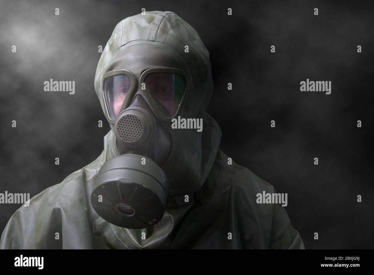 Dark future. Man in NBC full protective suit and gas mask Stock Photo ...