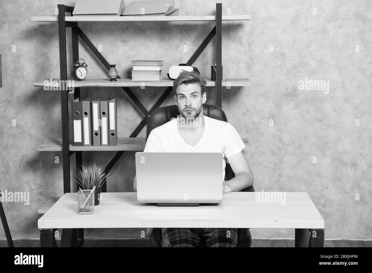 Taking advantage of new technology. Man work on laptop at home ...