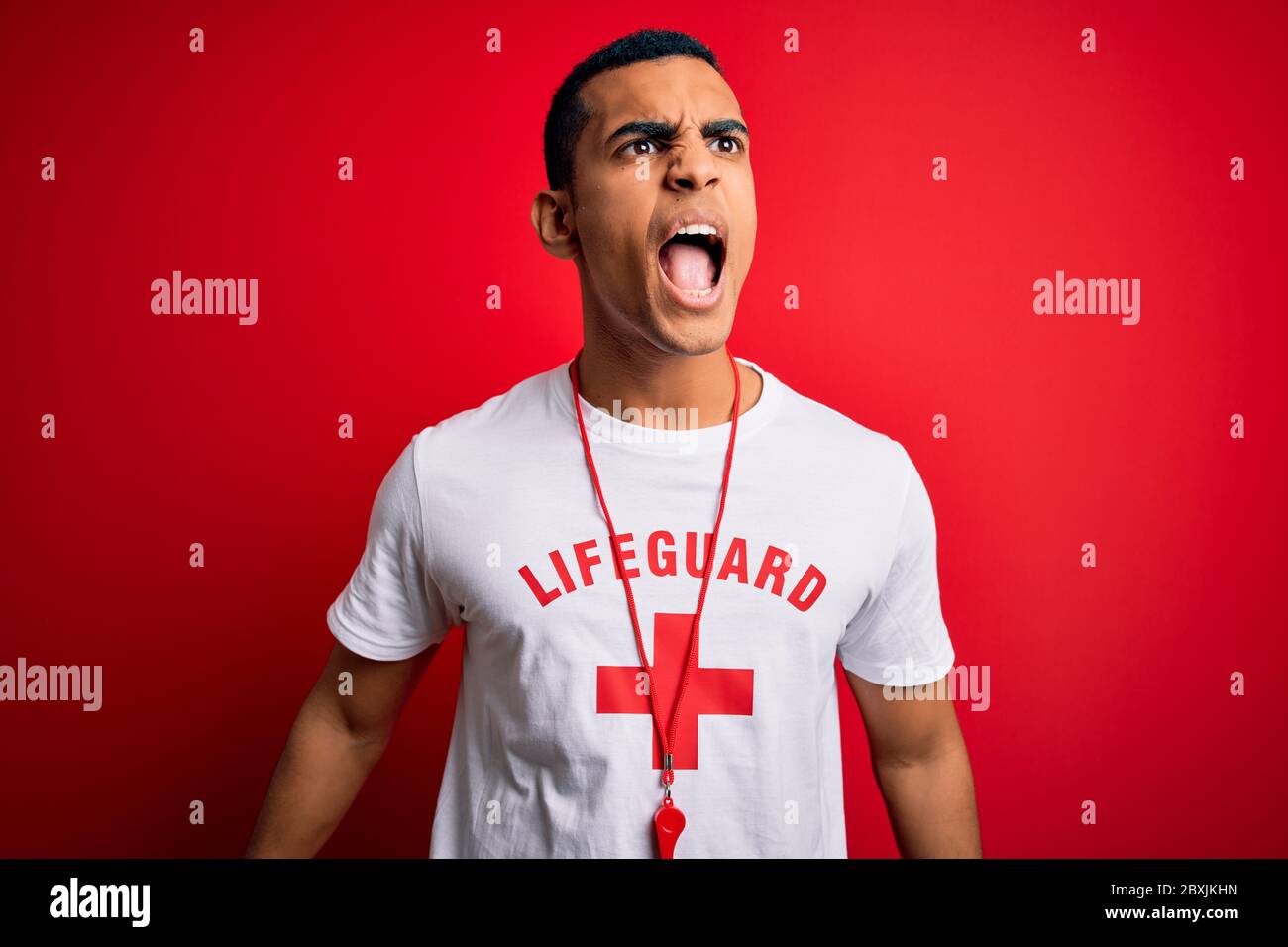 Young handsome african american lifeguard man wearing t-shirt with red ...