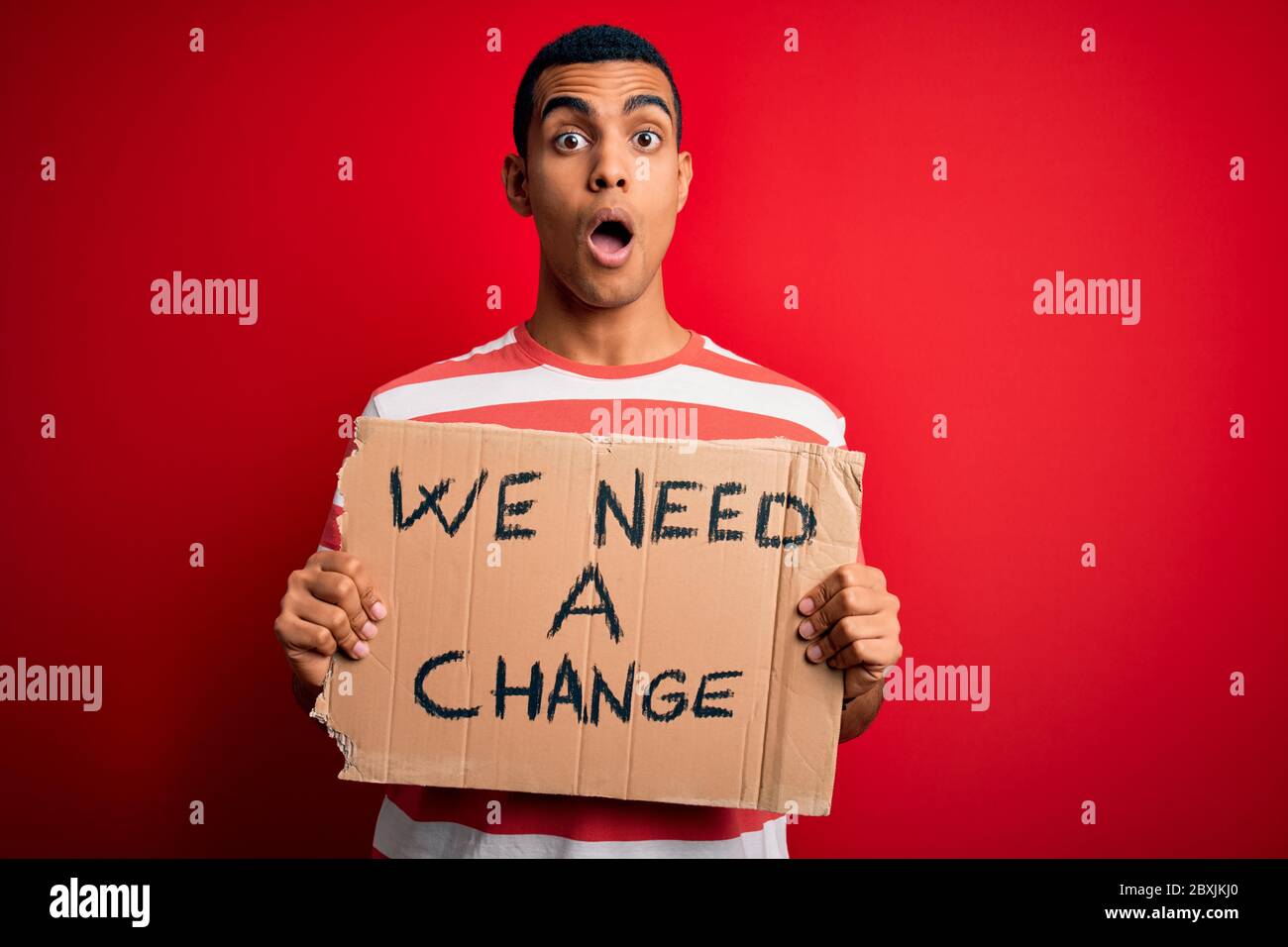 Young handsome african american activist man asking for change holding ...
