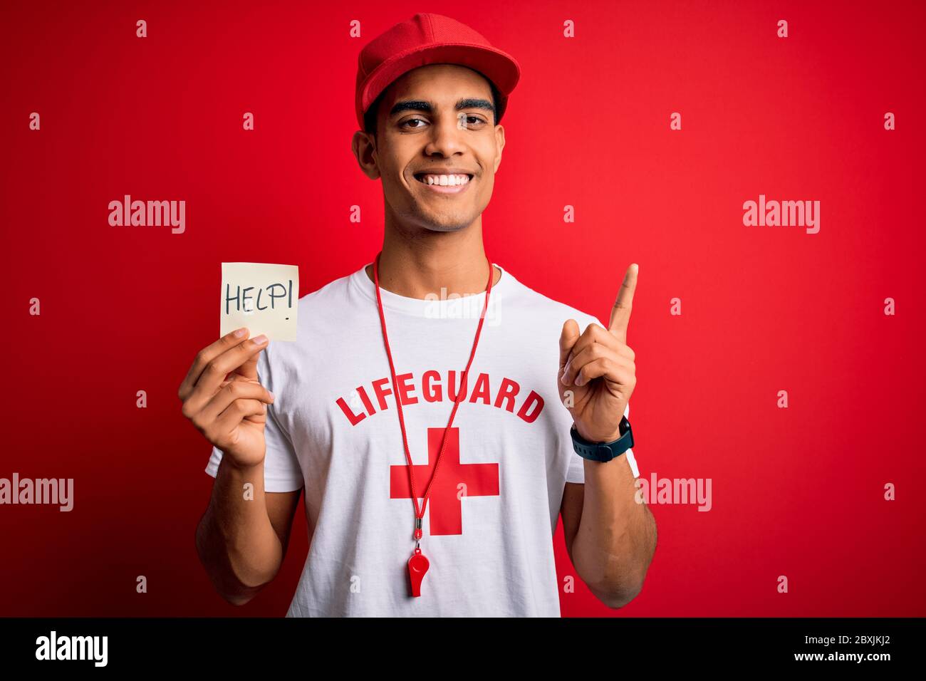 Young handsome african american lifeguard man wearing whistle holding ...