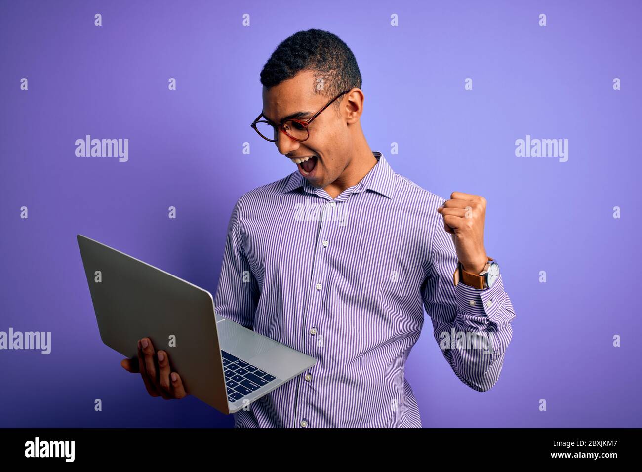 Young handsome african american business man working using laptop over ...