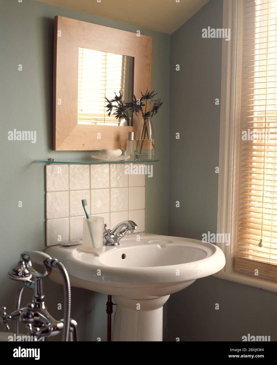 Closeup of basin in corner of bathroom Stock Photo - Alamy