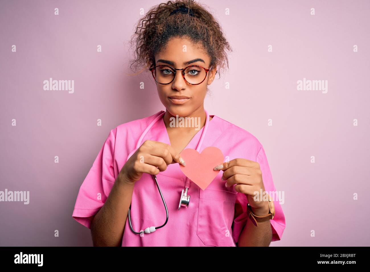 African american cardiologist girl wearing medical uniform and ...