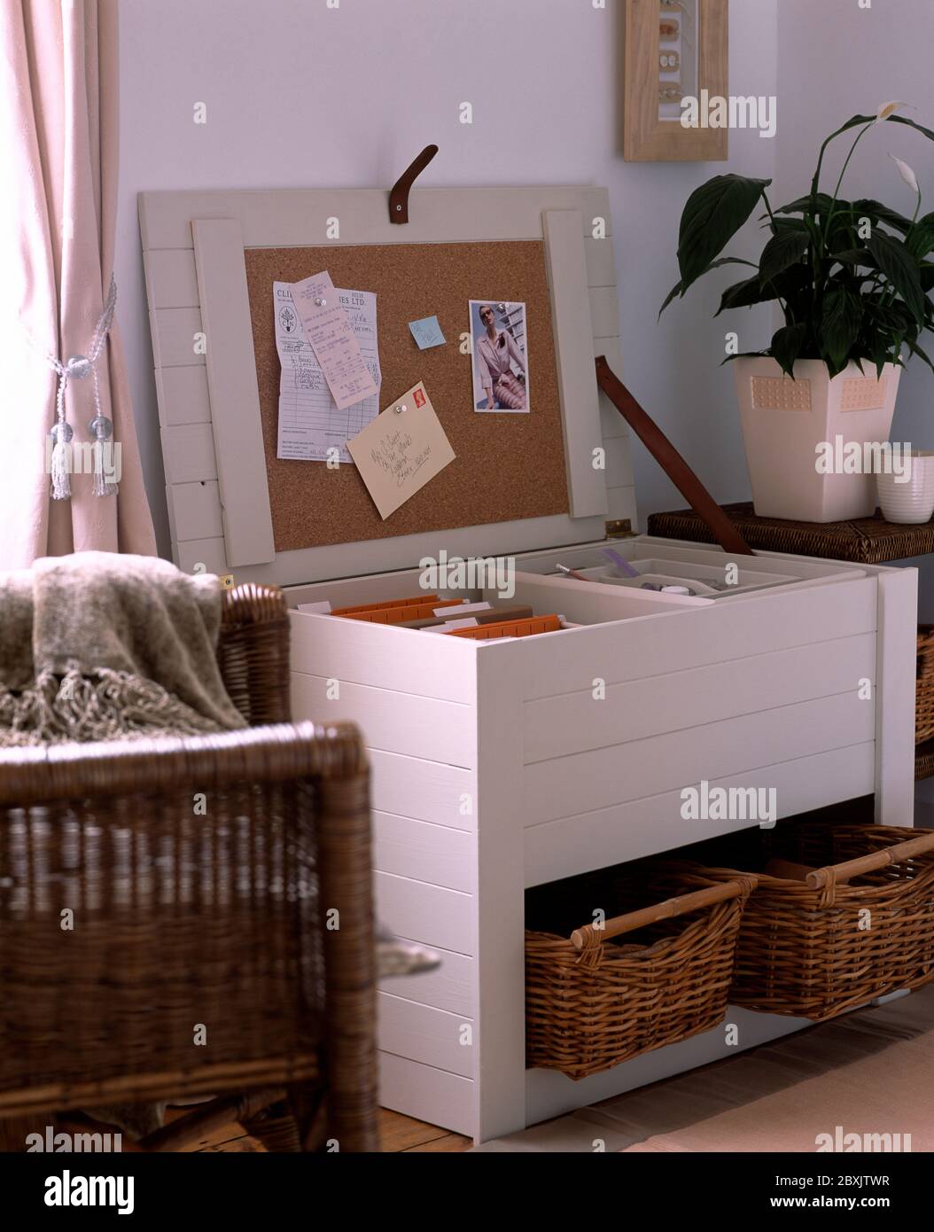 Home office with cork pin board that hides away Stock Photo - Alamy