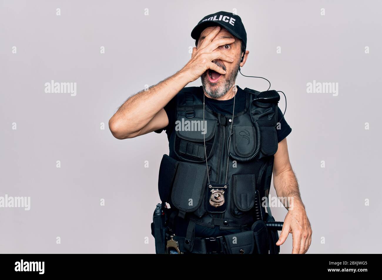 Middle age policeman wearing police uniform and bulletproof vest over ...