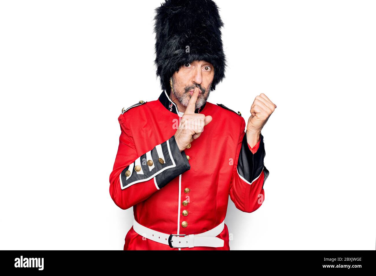 Middle age handsome wales guard man wearing traditional uniform over ...