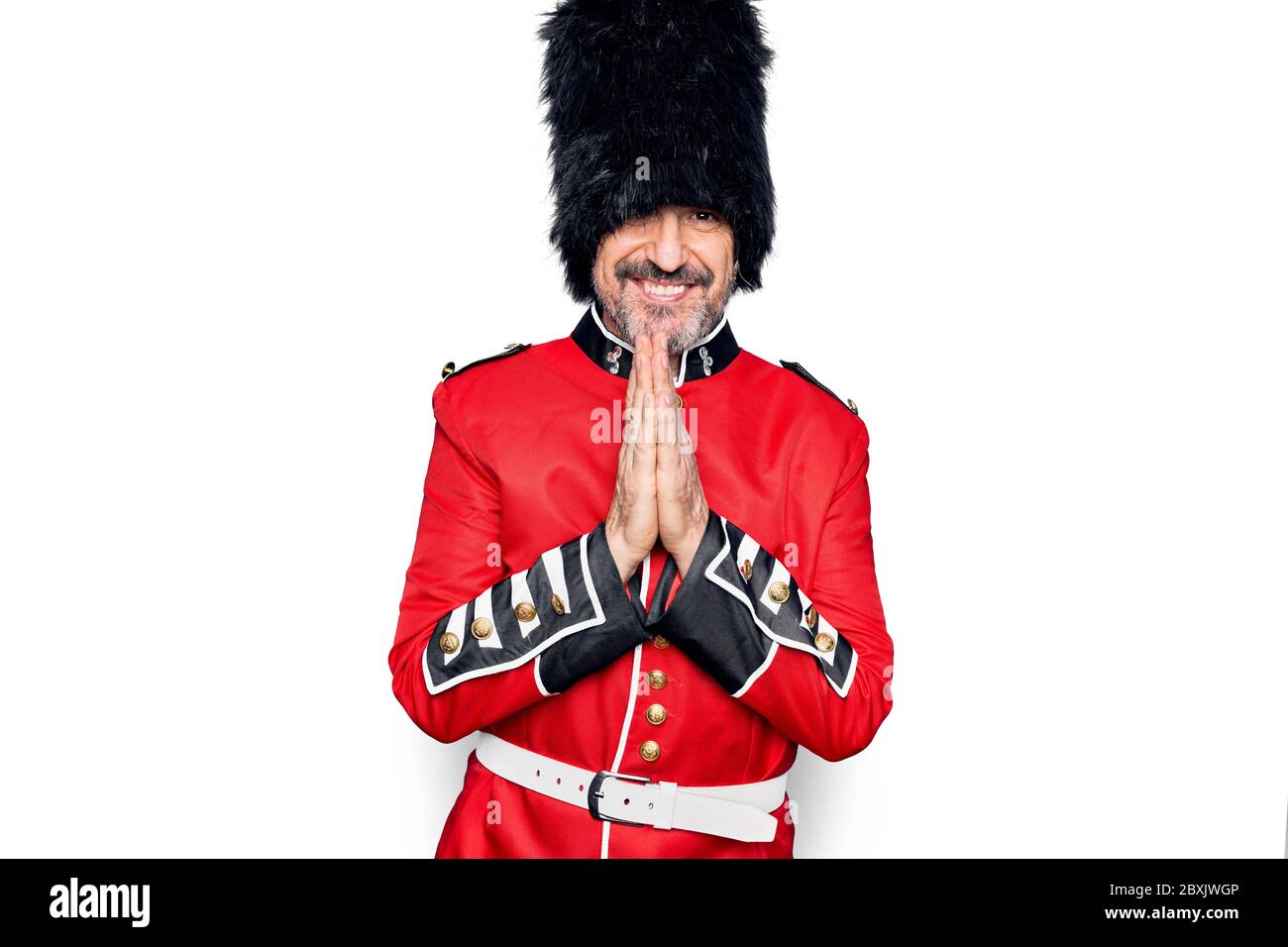 Middle age handsome wales guard man wearing traditional uniform over ...