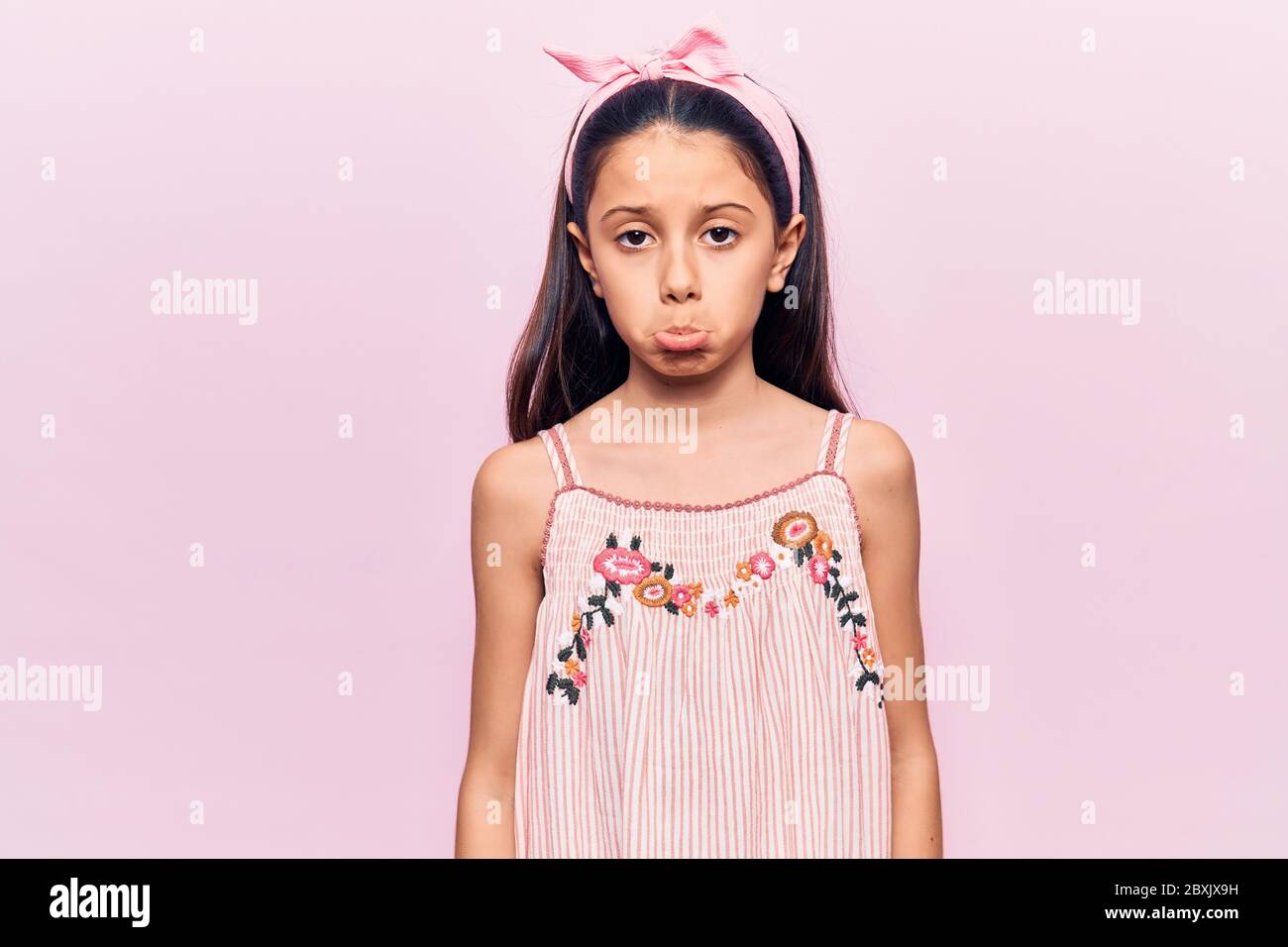 Beautiful child girl wearing casual clothes depressed and worry for ...