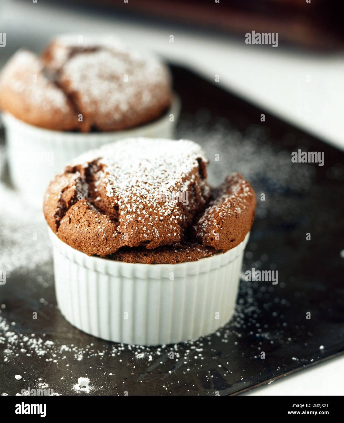 Individual chocolate suffles just out of oven Stock Photo - Alamy