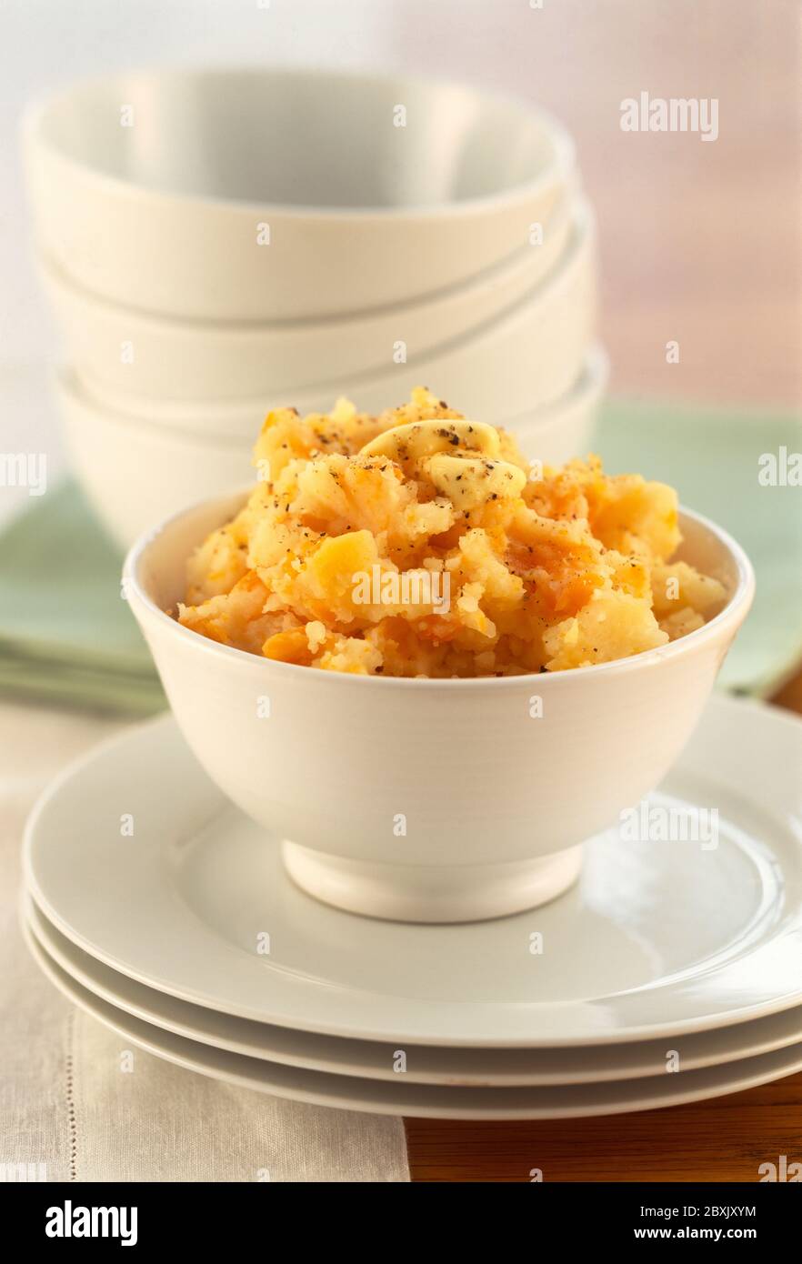 Swede mash with knob of butter on top Stock Photo - Alamy