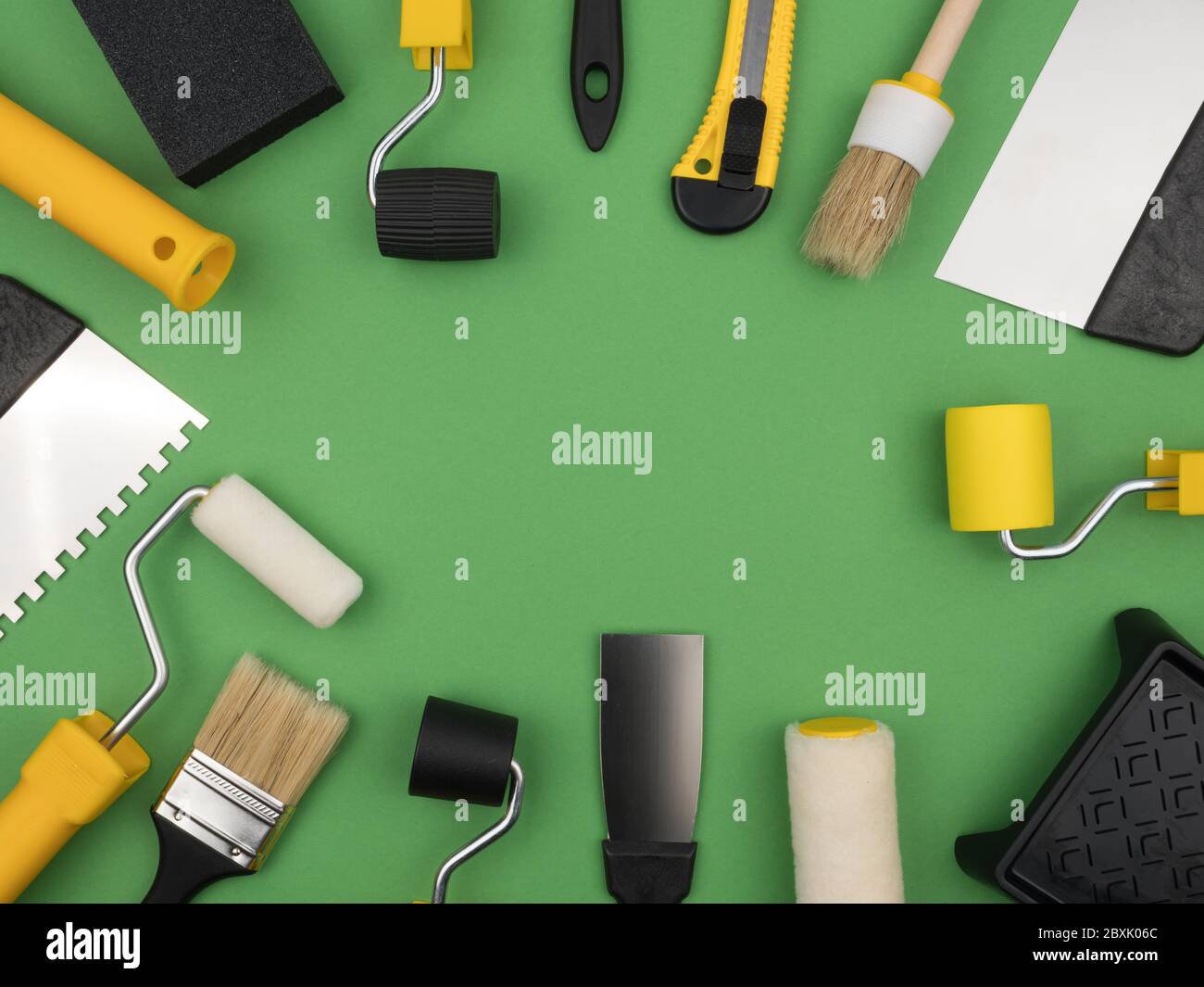 A set of tools for painting on a green background Stock Photo - Alamy
