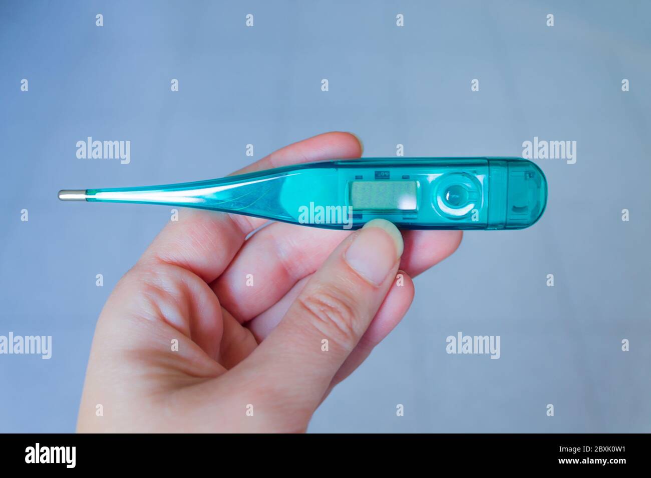 Hand holding thermometer hi-res stock photography and images - Alamy