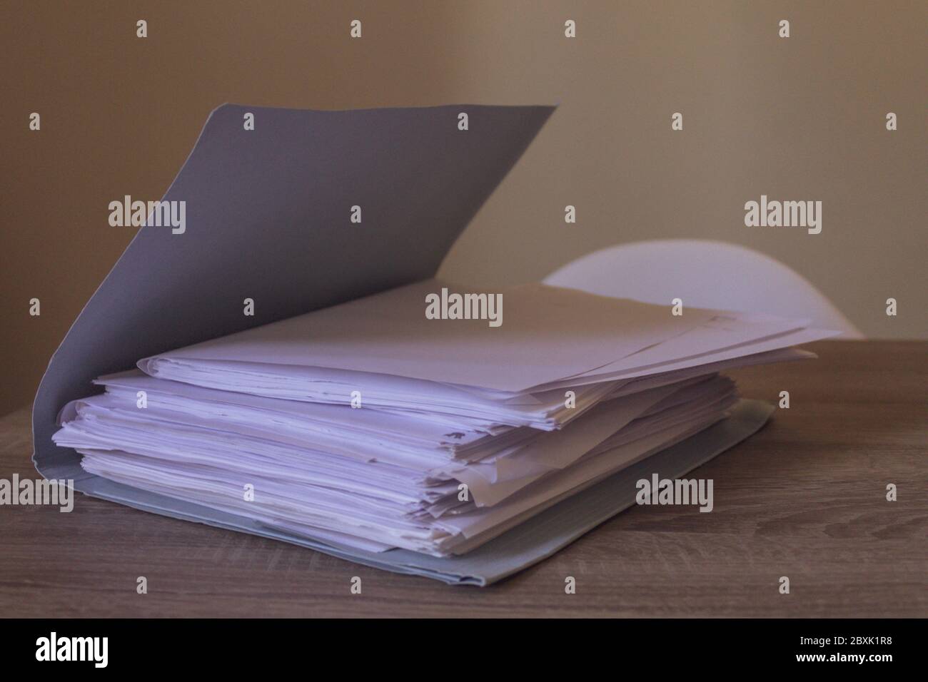 Stack of full file folder on a wooden desk with copy space Stock Photo ...