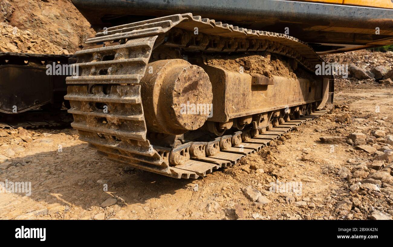 Excavator wheels with ground attached. The maintenance process is ...