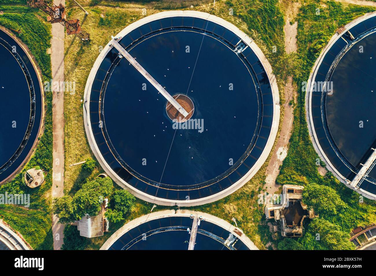 Aerial top view of round polls in wastewater treatment plant ...