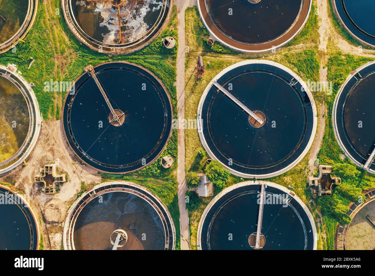 Aerial top view of round polls in wastewater treatment plant ...