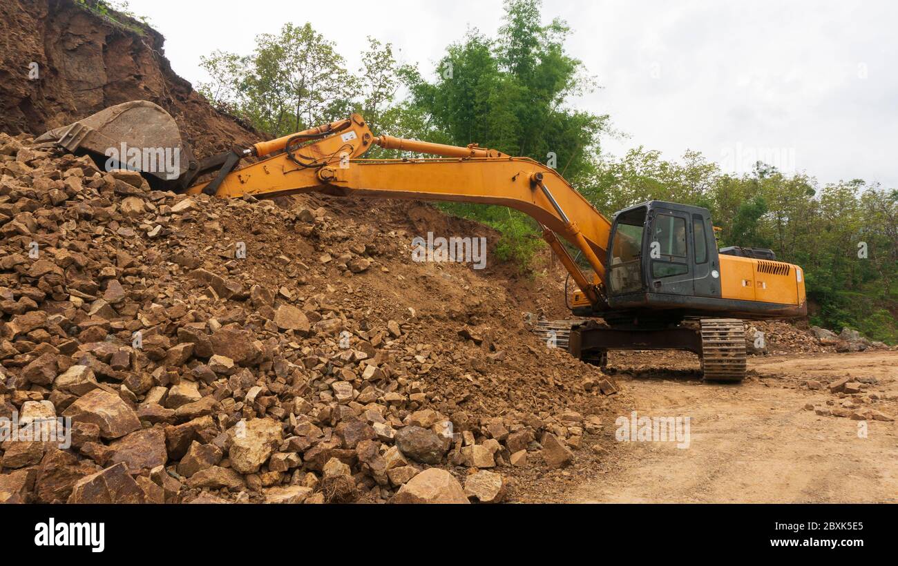 Excavators at the mine site. The process of dredging mining materials ...