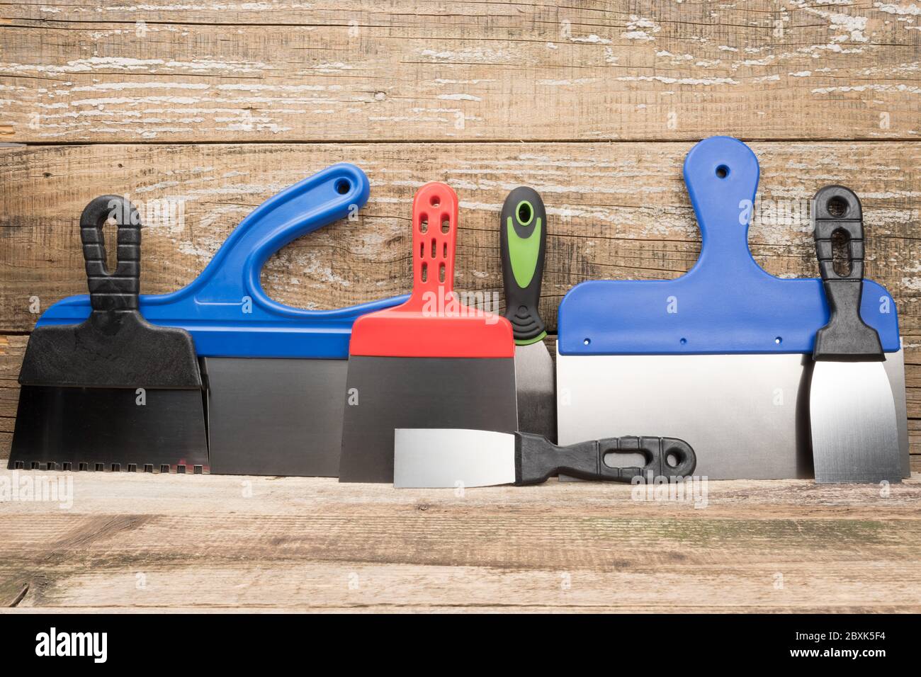 The tool of the painter and plasterer. Wooden background Stock Photo ...