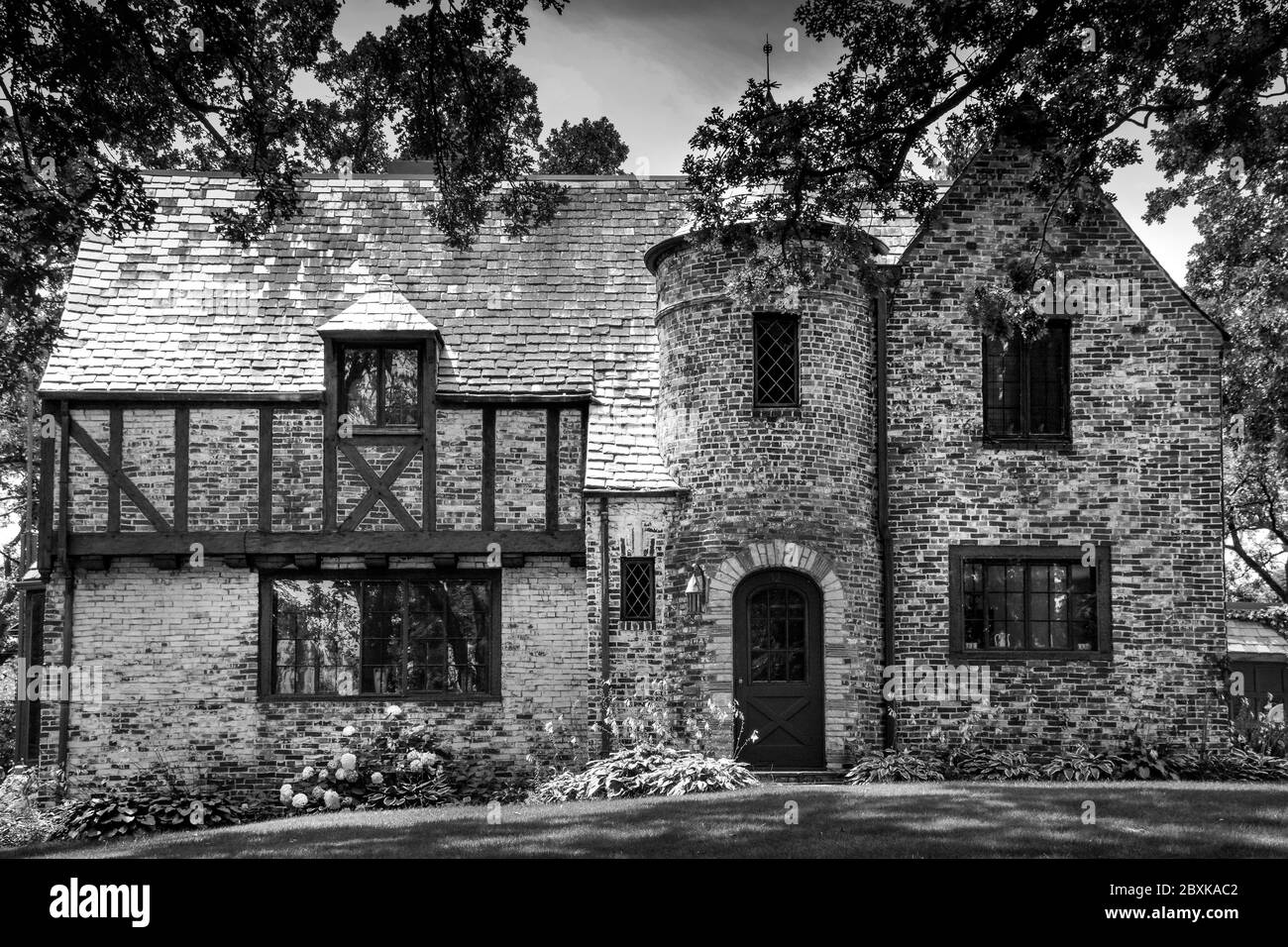 A stunning brick residence in a turdoresque style with French Norman ...