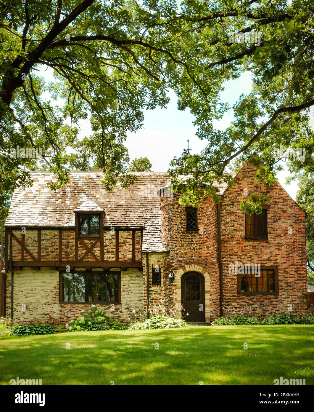 A stunning brick residence in a Tudoresque style with French Norman ...