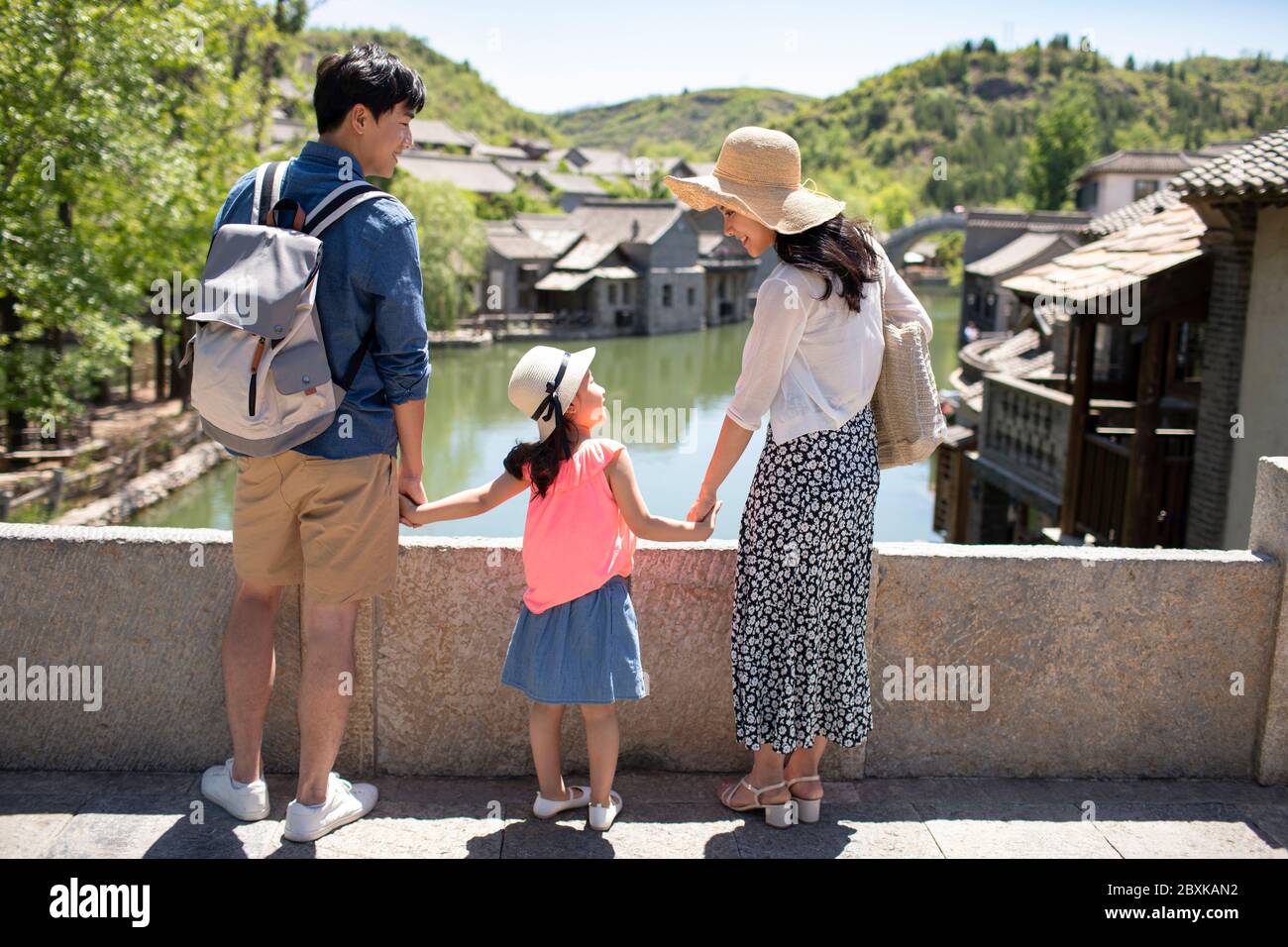 Young Chinese family enjoying vacation Stock Photo - Alamy