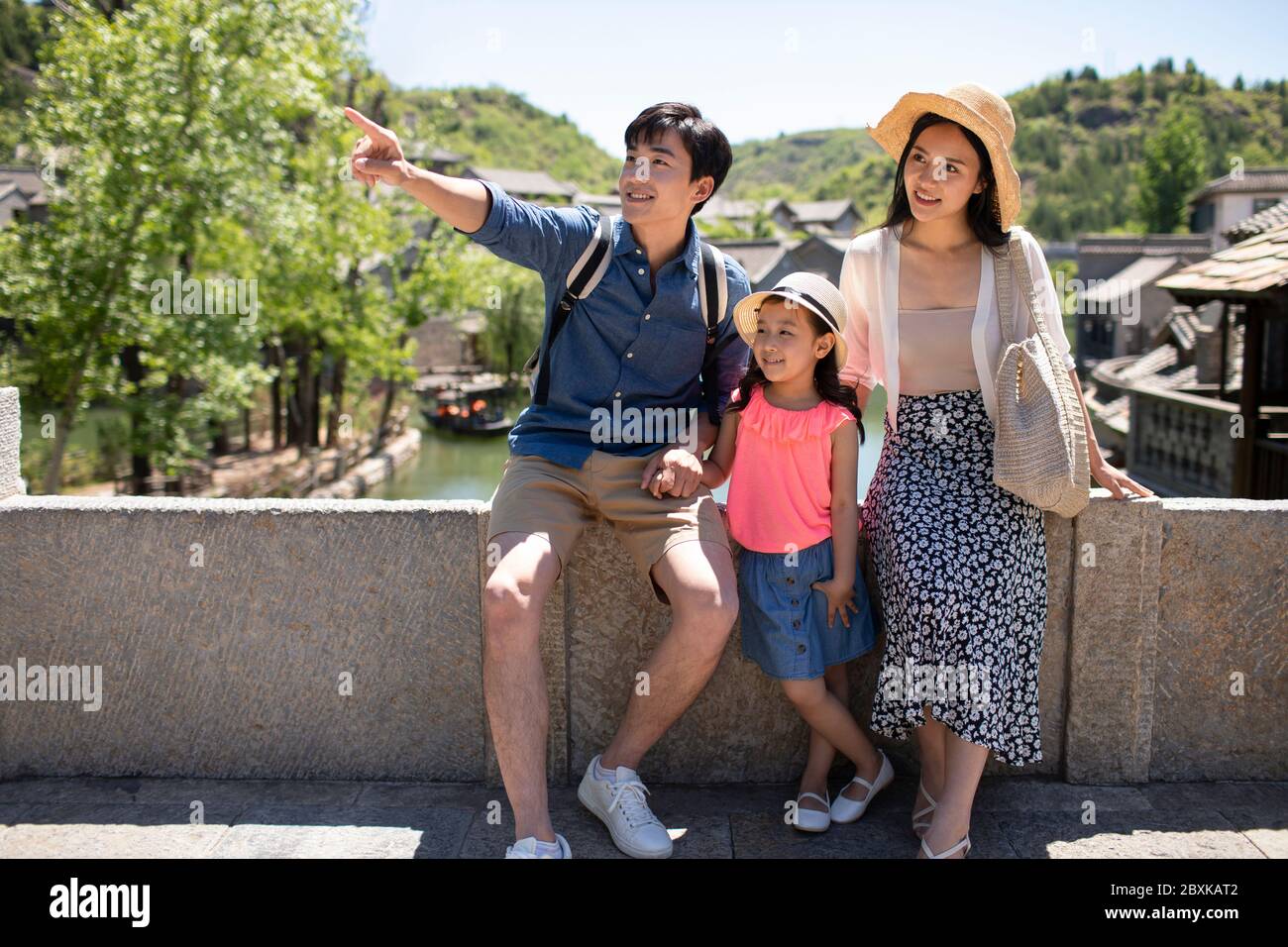 Young Chinese family enjoying vacation Stock Photo - Alamy