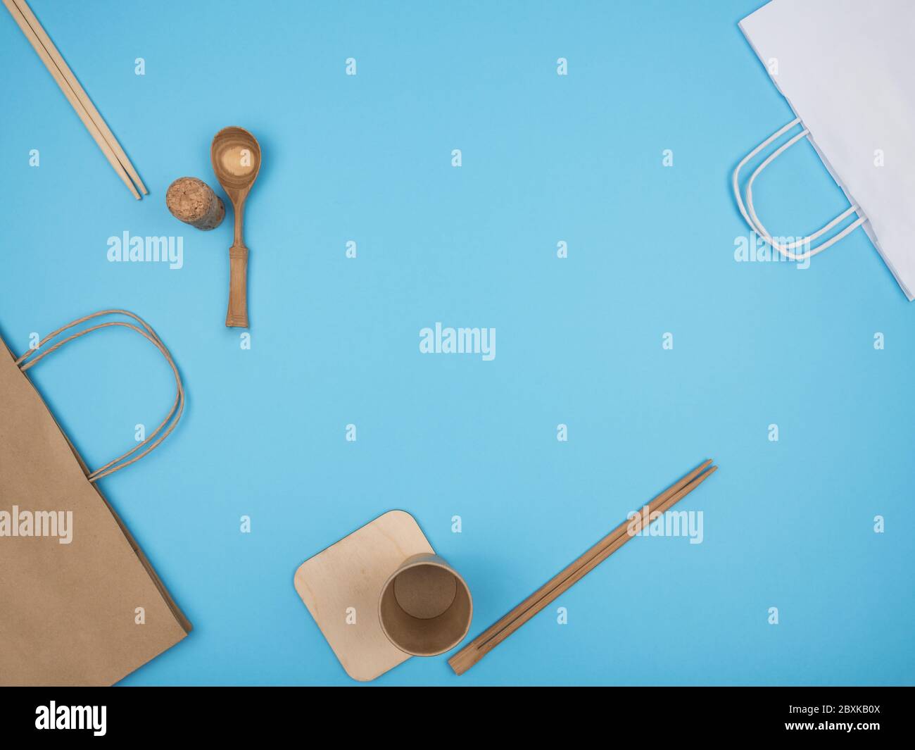 Paper bags and other items made of biodegradable materials on a blue ...