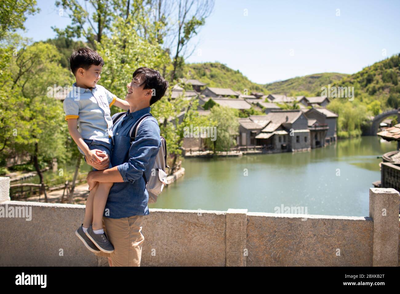 Happy Chinese father and son enjoying vacation Stock Photo - Alamy