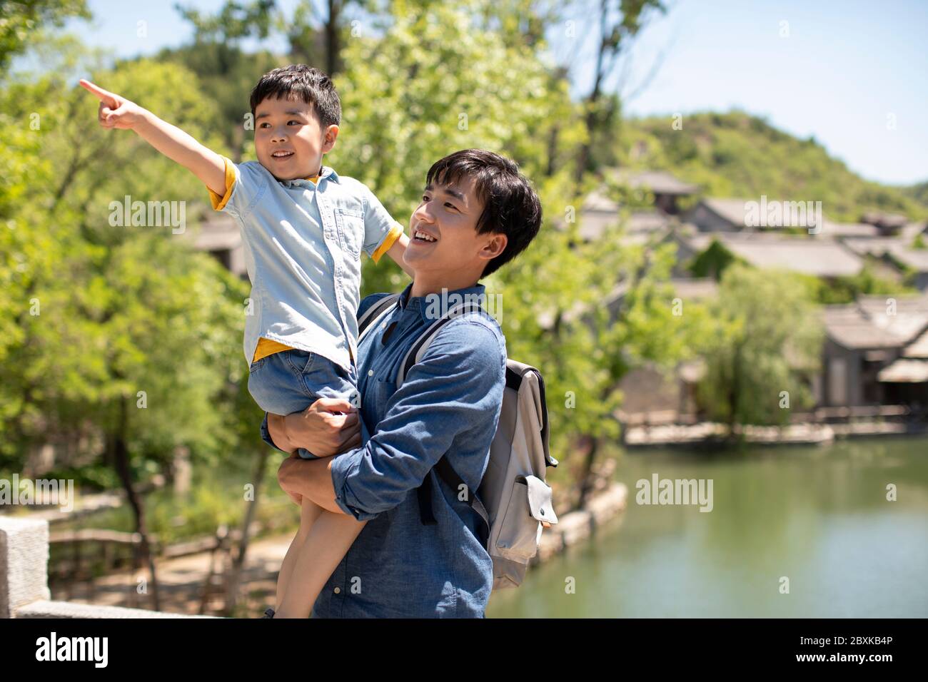 Happy Chinese father and son enjoying vacation Stock Photo - Alamy