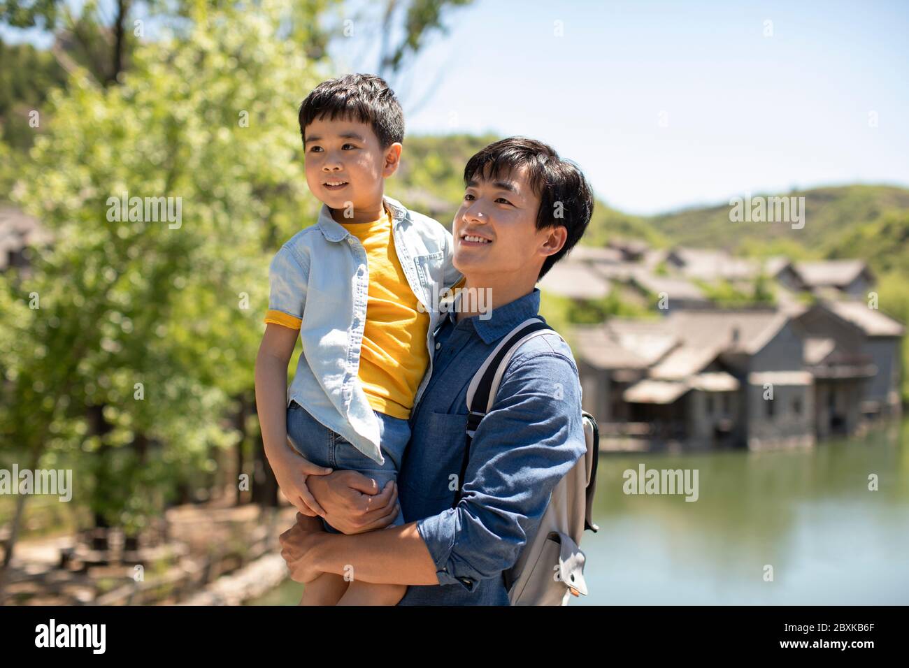 Happy Chinese father and son enjoying vacation Stock Photo - Alamy