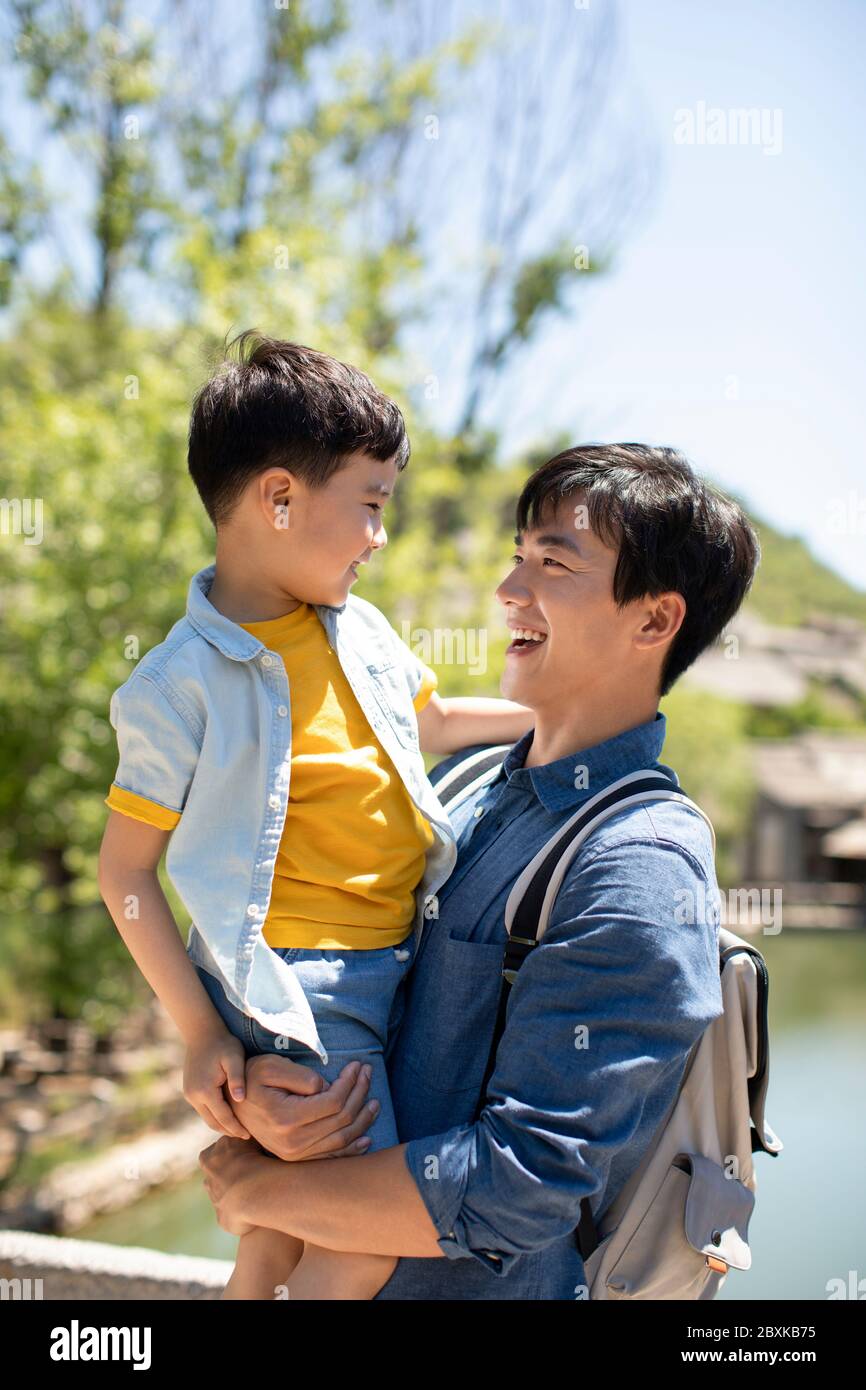 Happy Chinese father and son enjoying vacation Stock Photo - Alamy