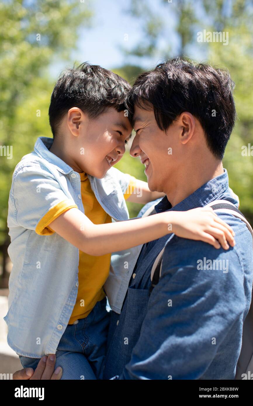 Happy Chinese father and son enjoying vacation Stock Photo - Alamy