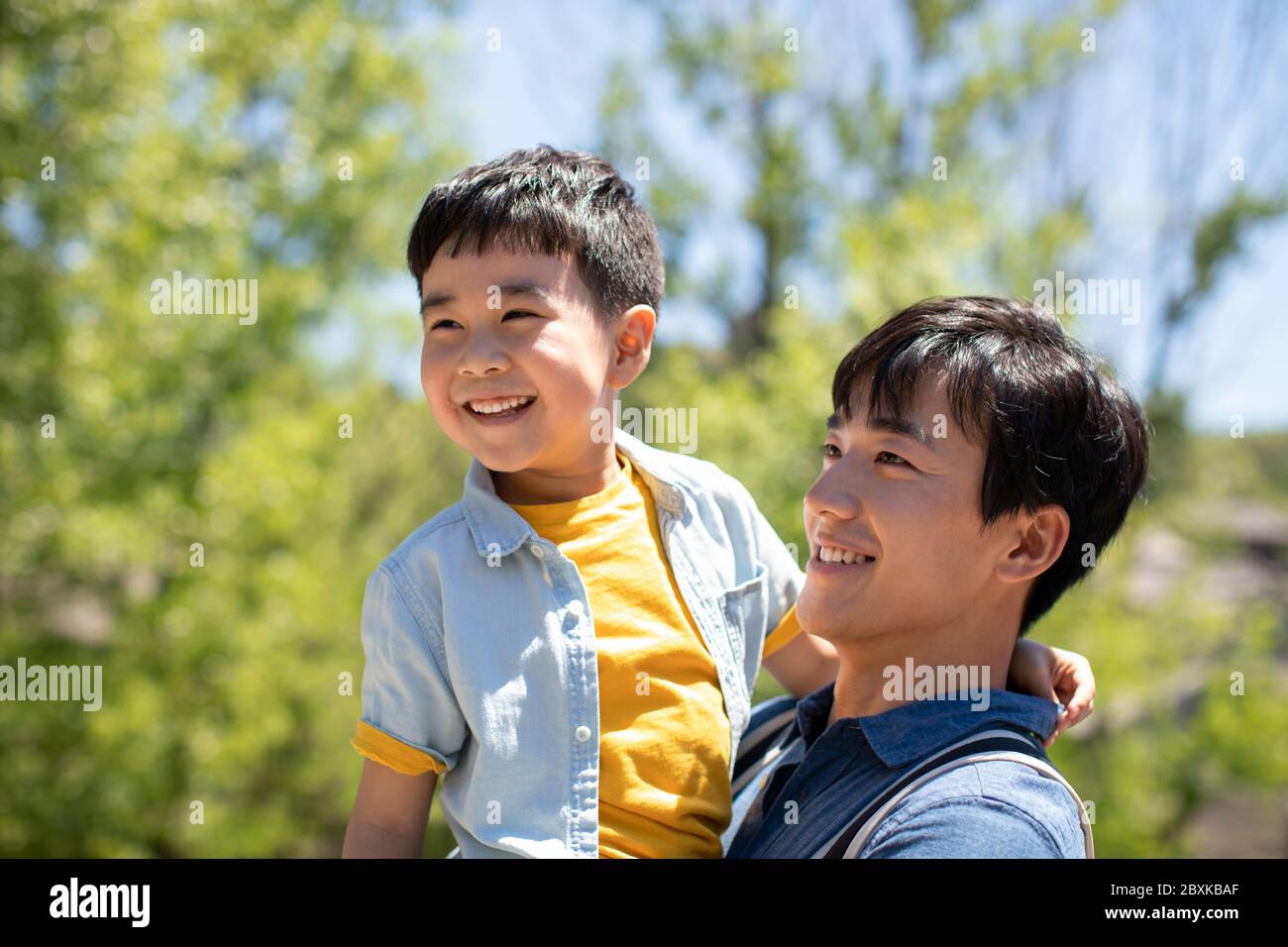 Happy Chinese father and son enjoying vacation Stock Photo - Alamy