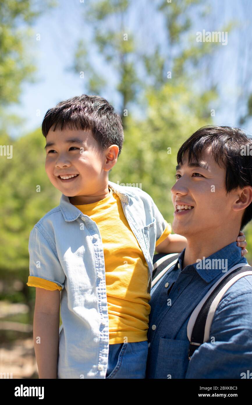 Happy Chinese father and son enjoying vacation Stock Photo - Alamy