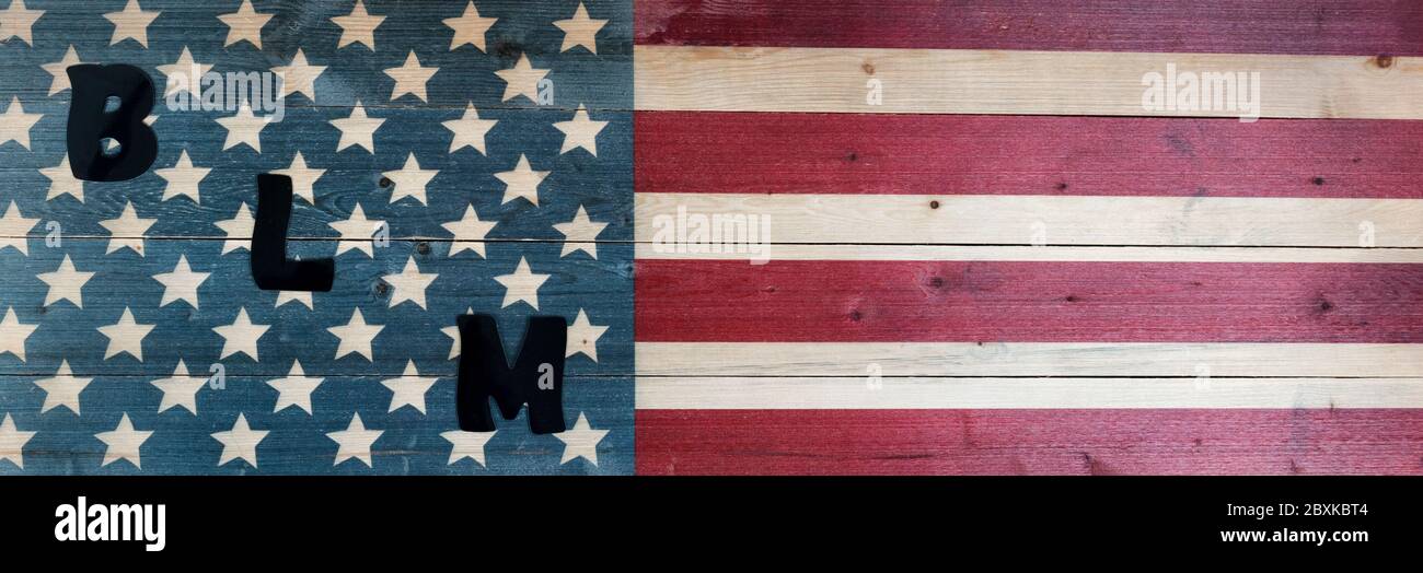 BLM capital letters on United States vintage wooden flag for black ...