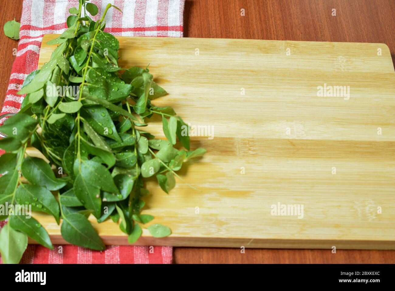 Bunch of Fresh Indian Curry Leaves / Curry Leaf on Wooden Background ...