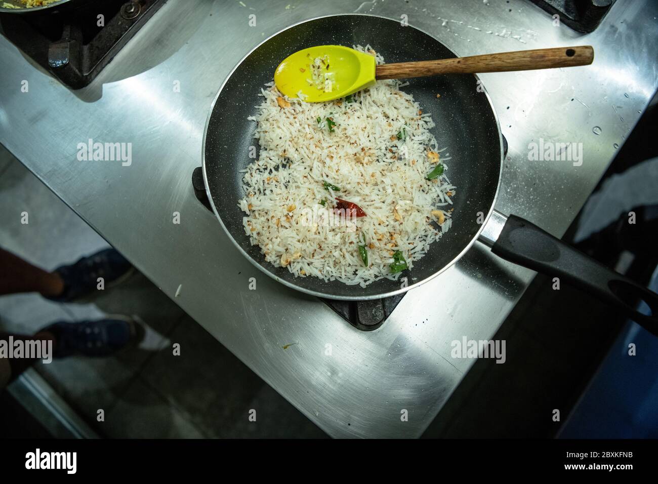 Demonstration of cooking sauteed and spiced rice in South India Stock ...