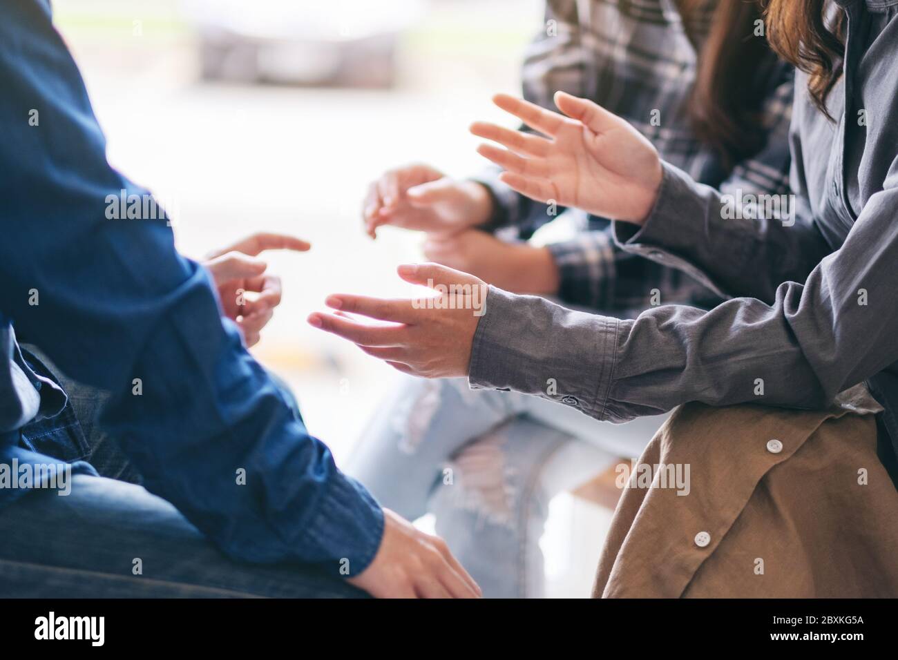 People sitting and talking together Stock Photo - Alamy