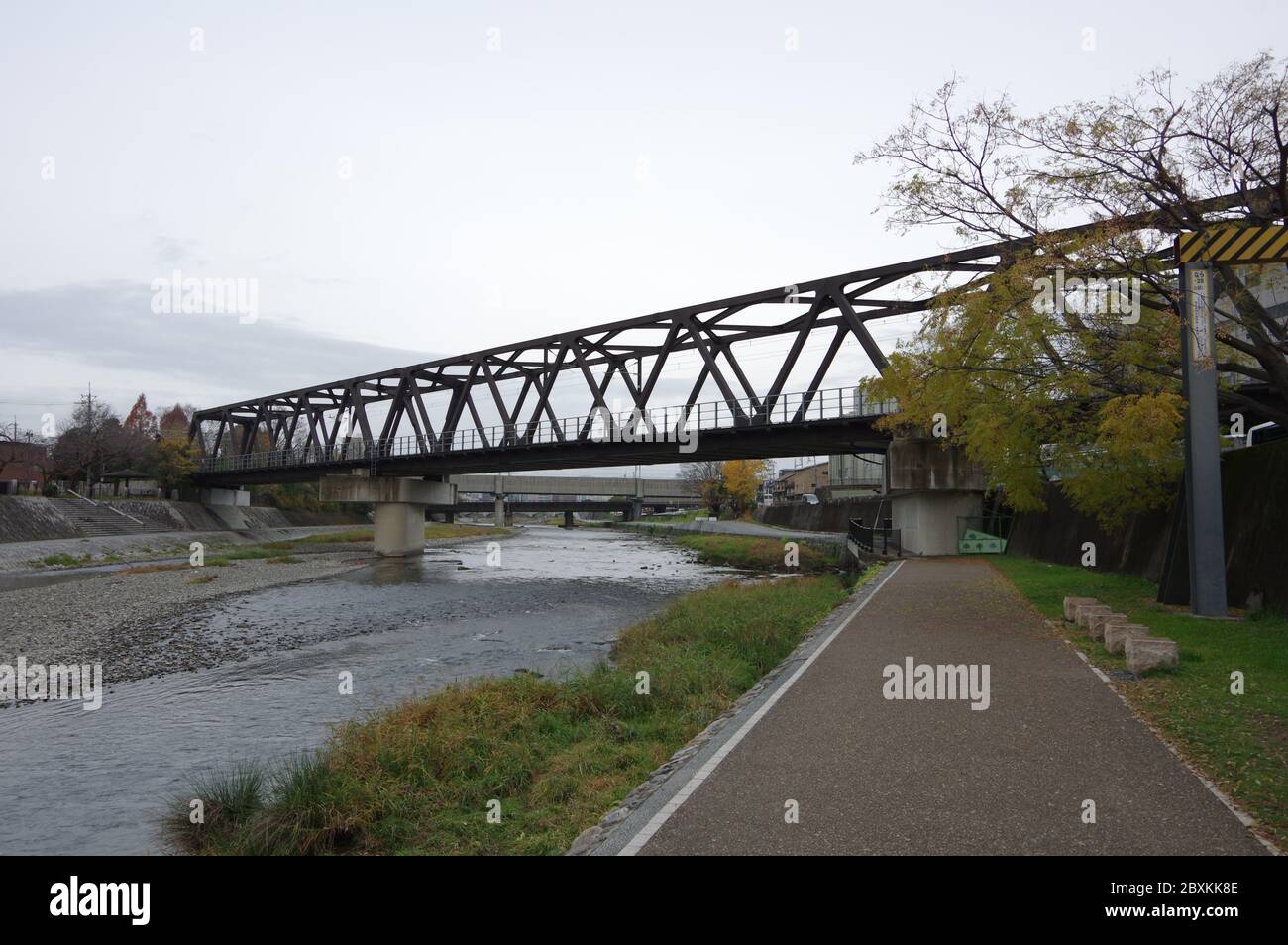 Steel truss bridge for trains on Kamo River in Kyoto, Japan Stock Photo ...