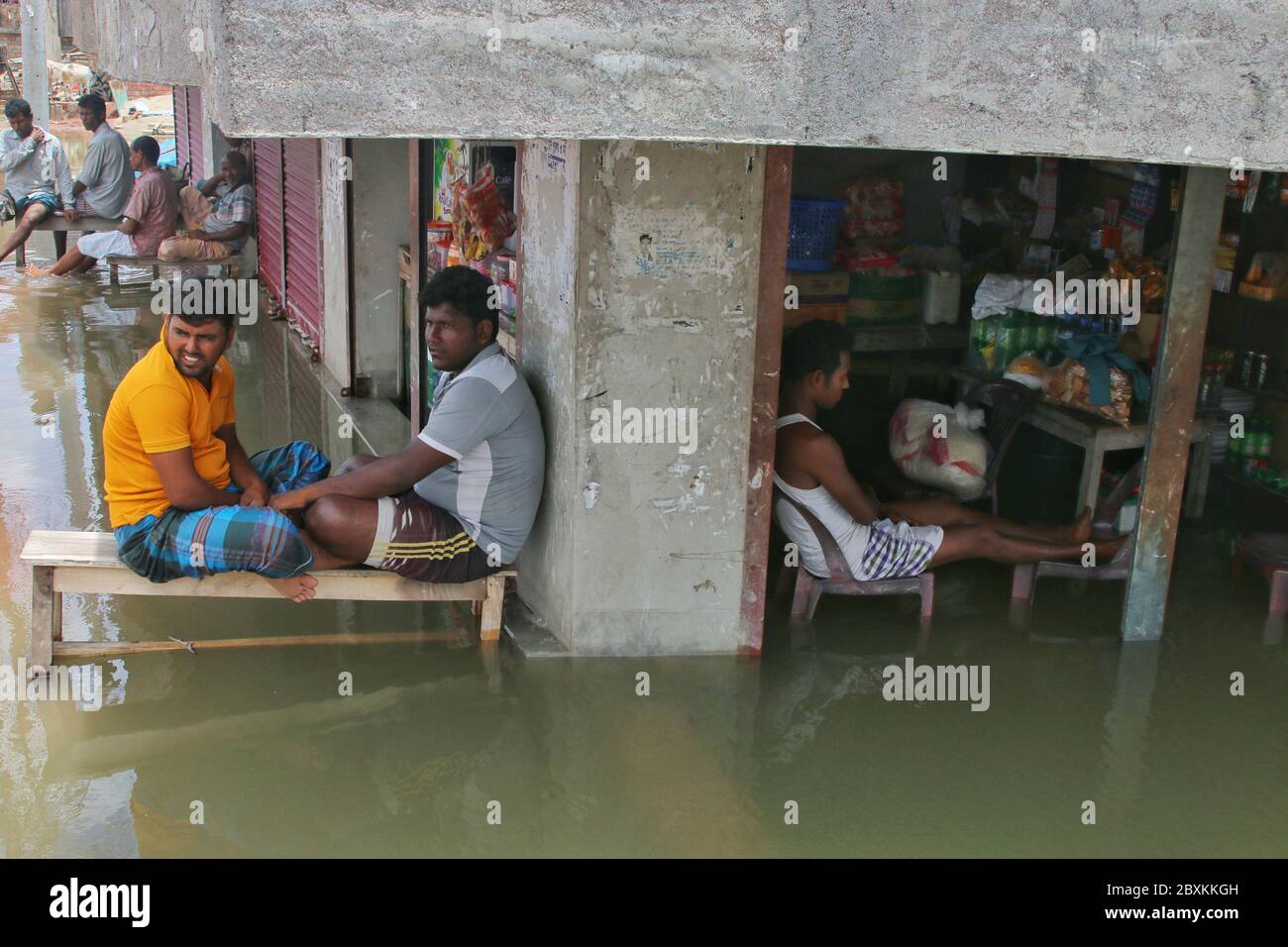 Assasuni, Bangladesh. 05th June, 2020. Local people sitting at a ...