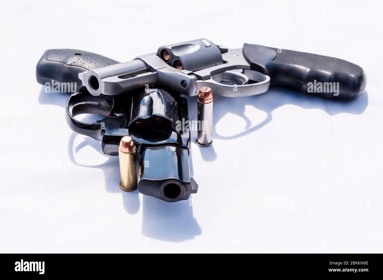 Two revolvers, a 357 magnum and a 38 special with hollow point bullets for each of them on a ...