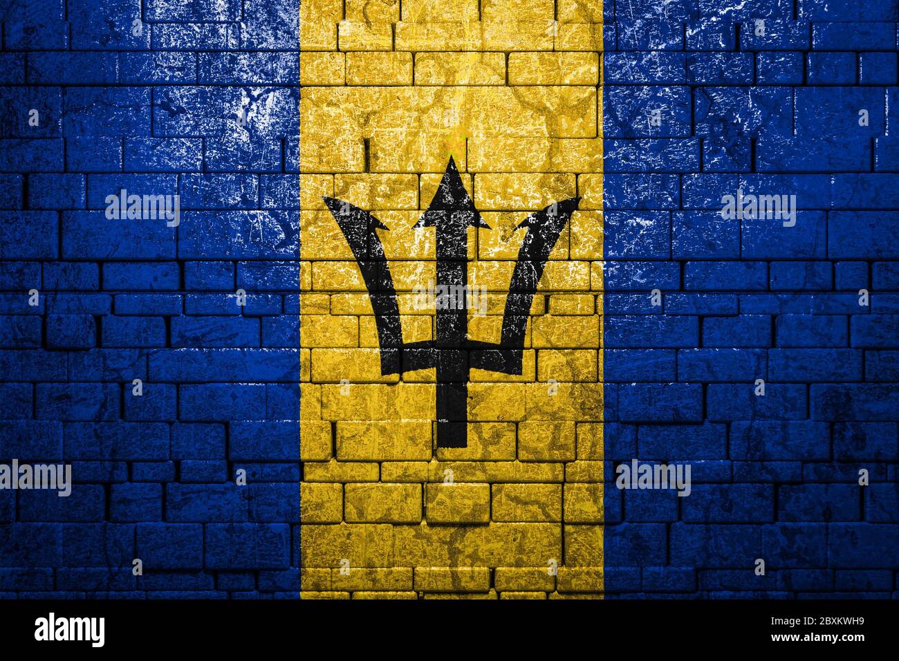 National flag of Barbados on brick wall background.The concept of ...