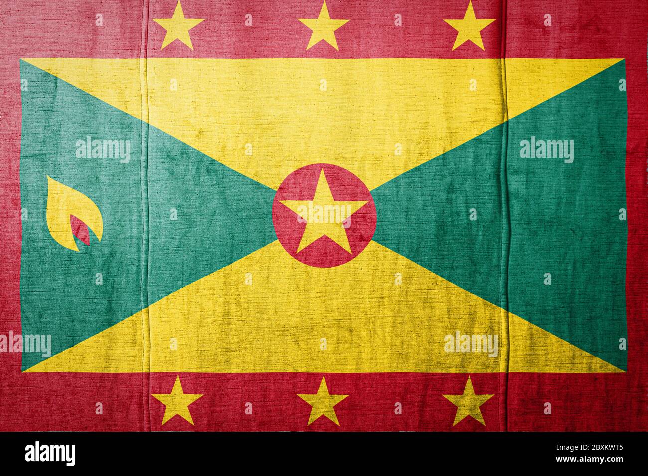 National flag of Grenada depicting in paint colors on old textile. Flag ...