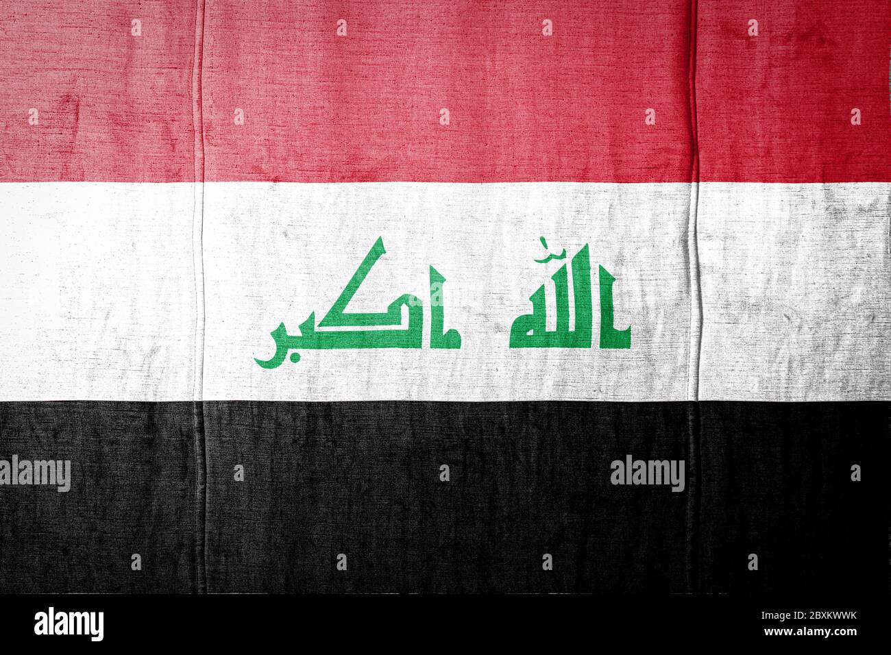 National flag of Irak depicting in paint colors on old textile. Flag ...