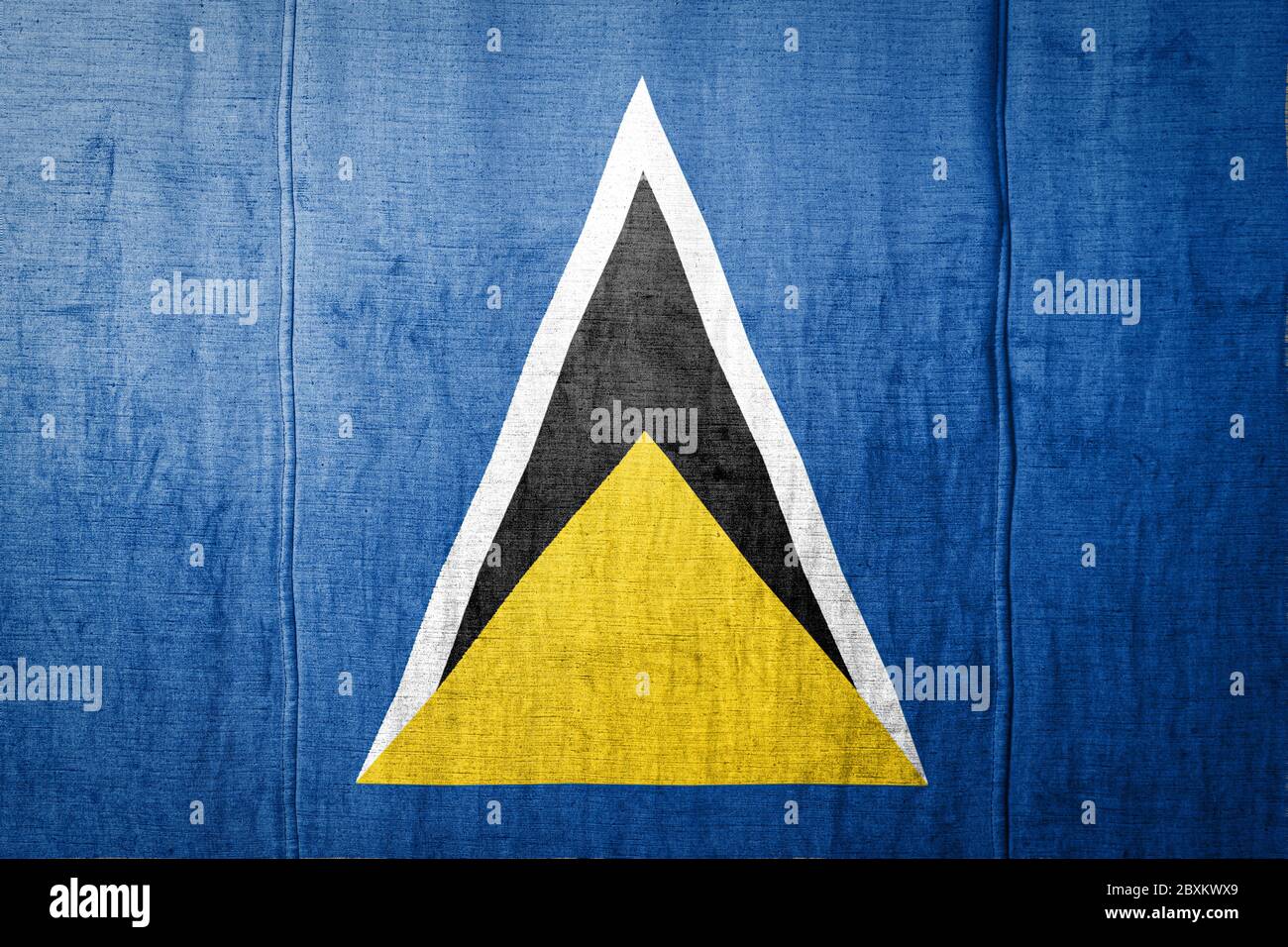 National flag of Saint Lucia depicting in paint colors on old textile ...